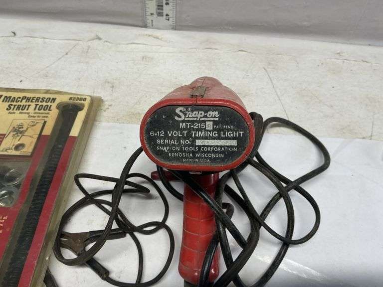 Snap-on timing light, strut tool, etc - Legacy Auction Company