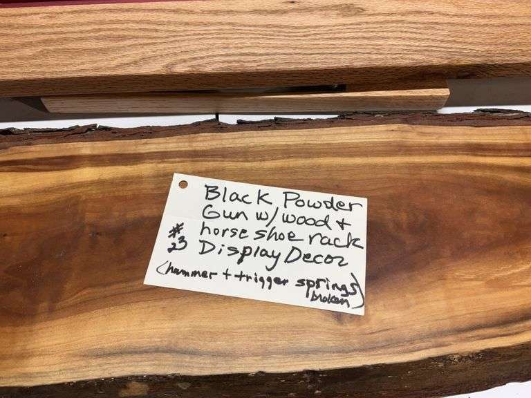 Black powder, gun with wood and horse shoe rack - Legacy Auction Company