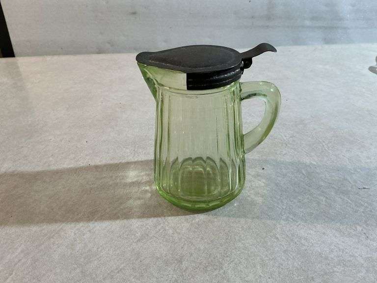 Green glass syrup pitcher-rim chips - Legacy Auction Company