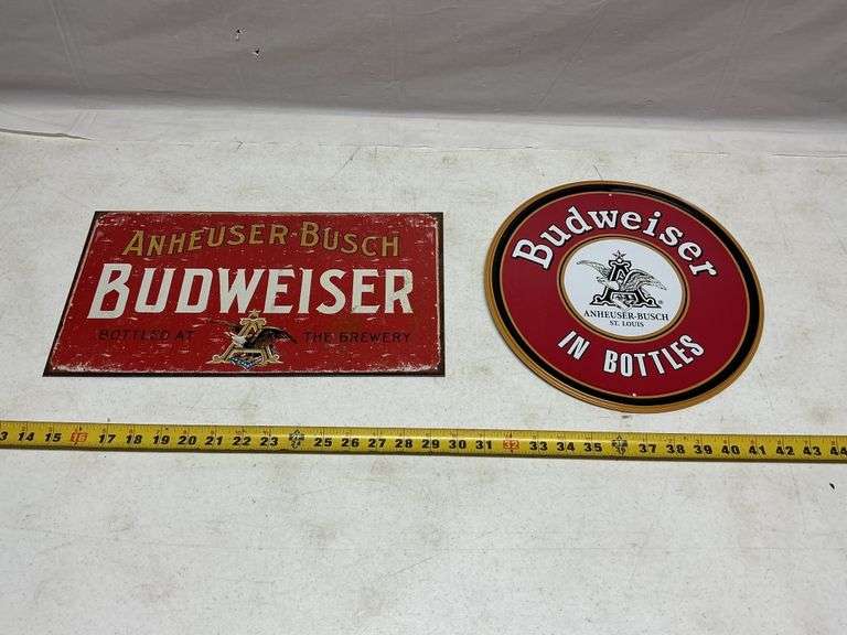 Metal Budweiser signs - Legacy Auction Company
