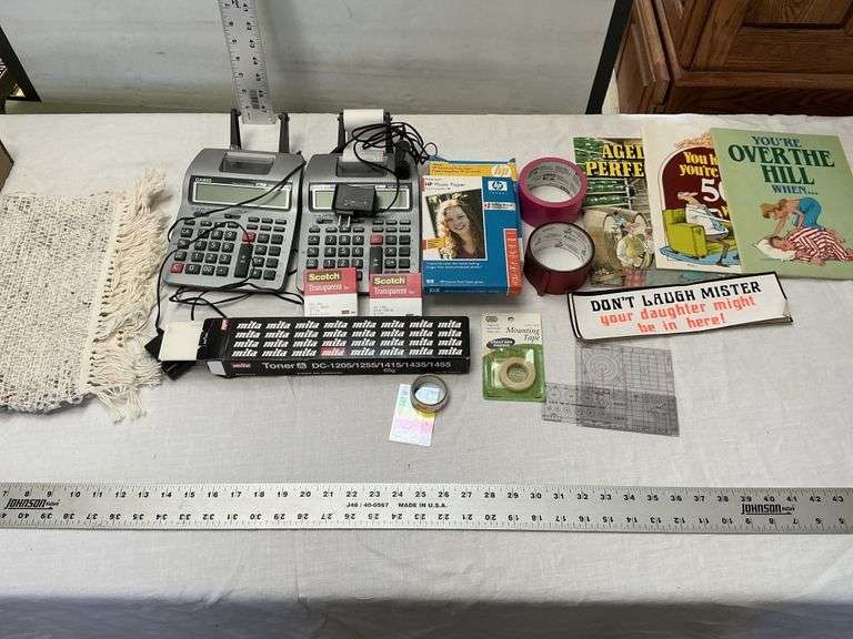 Adding machines, photo paper, joke books etc. - Legacy Auction Company