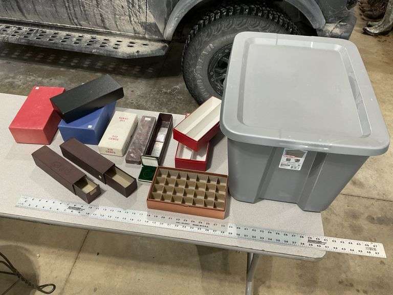 Tote with assorted coin boxes - Legacy Auction Company