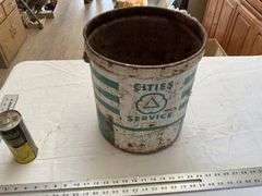 Cities Service vintage bucket and outboard motor - Legacy Auction Company