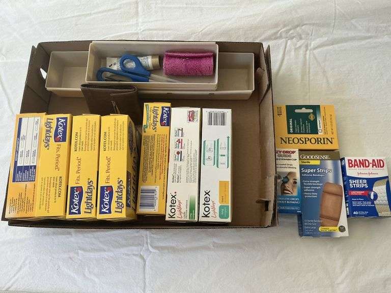 Feminine hygiene products, scissors, bandages - Legacy Auction Company