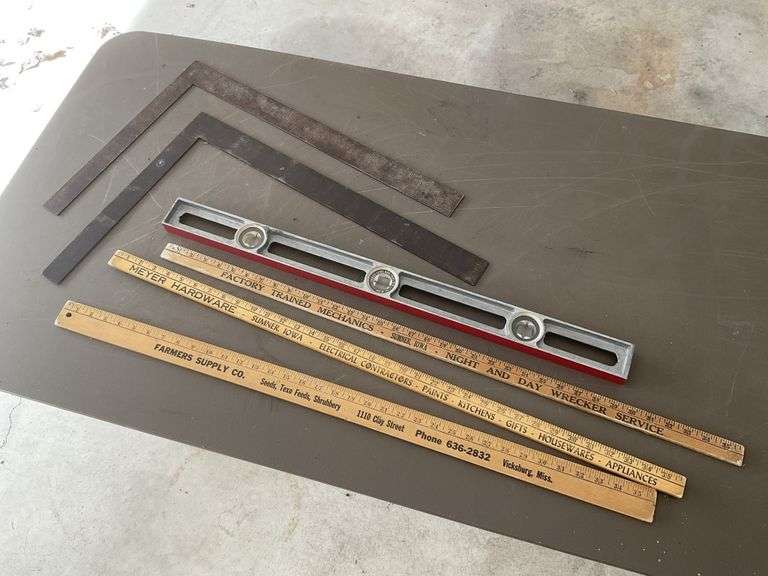 Advertising measuring sticks, level and squares - Legacy Auction Company