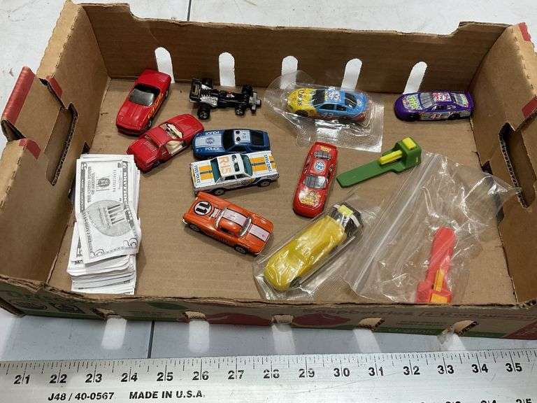 Toy cars and play money - Legacy Auction Company