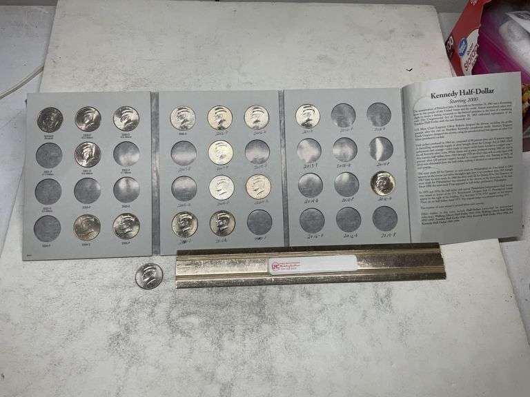 Kennedy half dollar album with extra 2009 D coin - Legacy Auction Company
