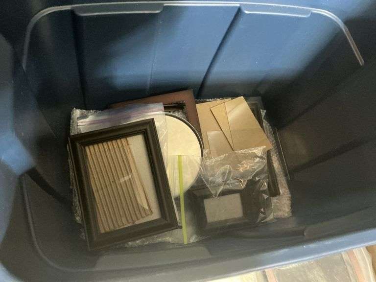 Frames, plate stands, etc. with tote - Legacy Auction Company