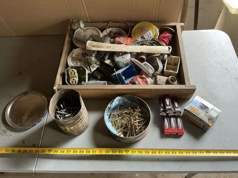 Buckets and boxes of hardware/spark plugs - Legacy Auction Company