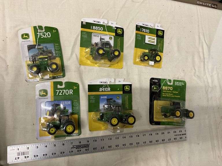 Assorted 1/64 scale John Deere tractors - Legacy Auction Company