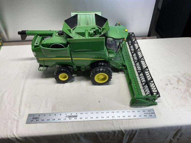 Plastic John Deere combine with bean head - Legacy Auction Company