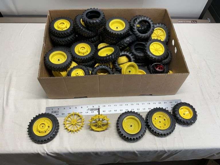 Box of assorted tractor toy, rims and tires, etc. - Legacy Auction Company