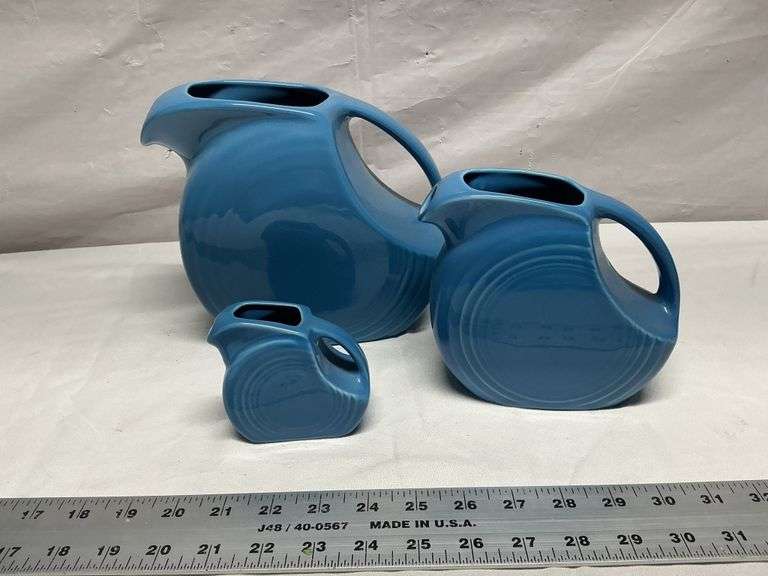 FiestaWare turquoise pitchers - Legacy Auction Company