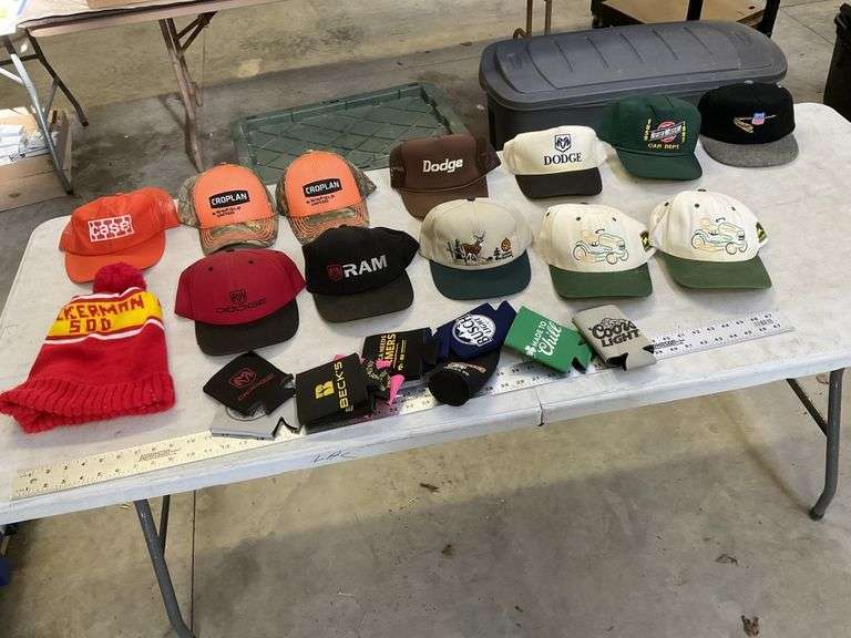 Assorted caps and Coozies - Legacy Auction Company