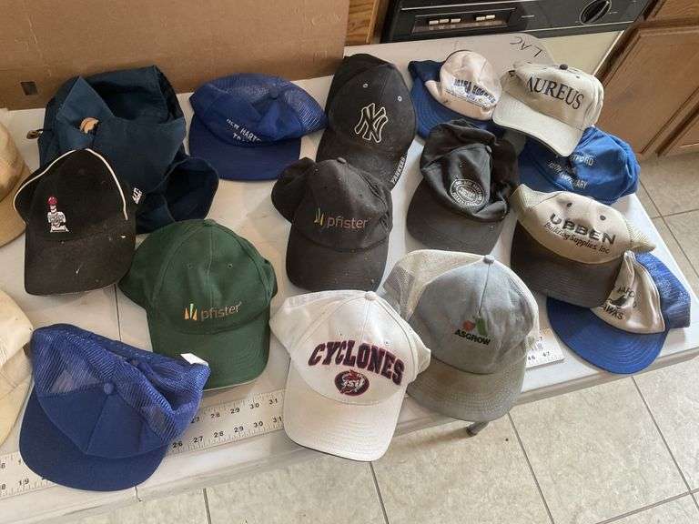 Assorted caps, some need cleaning - Legacy Auction Company