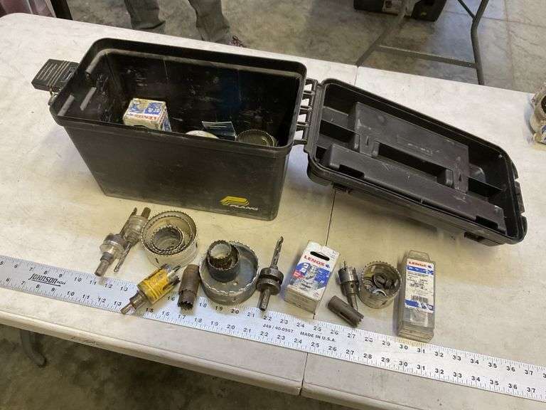 Plano Plastic ammo box with hole saws - Legacy Auction Company