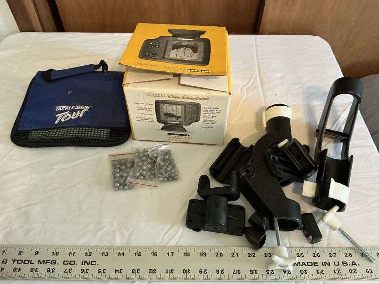 Depth finder, fishing pole holders, sinkers, - Legacy Auction Company