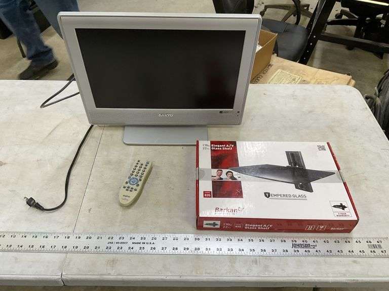 Sanyo 19" TV with remote and glass shelf - Legacy Auction Company