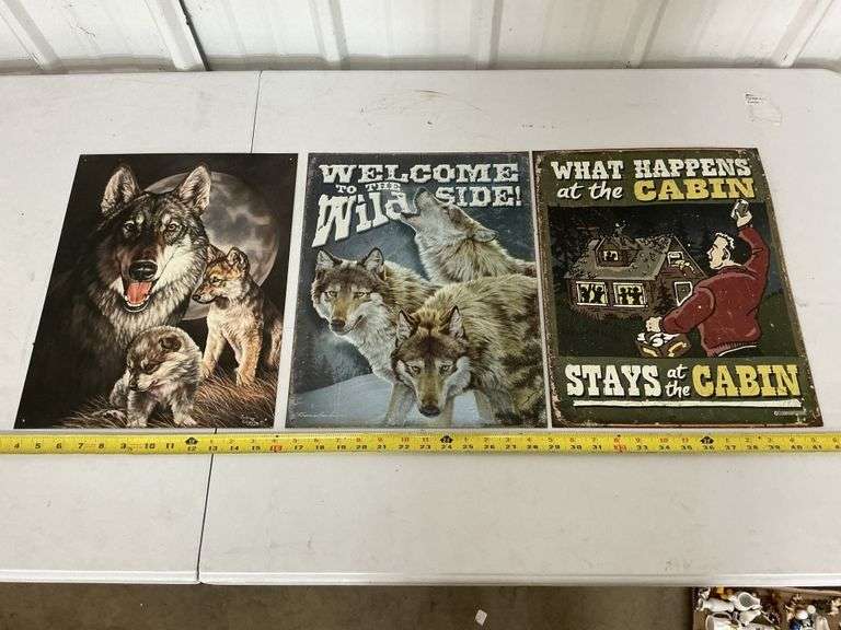 Metal wolf/cabin signs - Legacy Auction Company