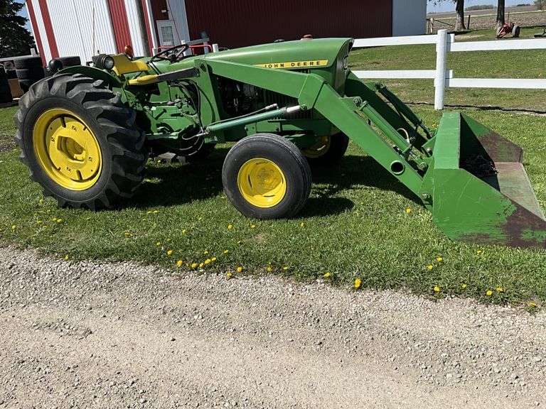 69 John Deere 1520 tractor with number 37 loader. - Legacy Auction Company