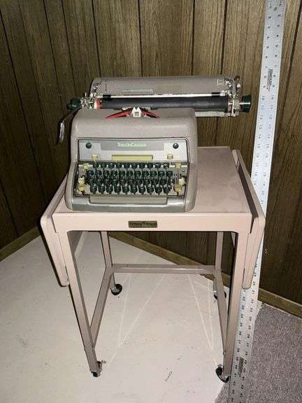 Vintage Smith Corona manual typewriter with stand - Legacy Auction Company