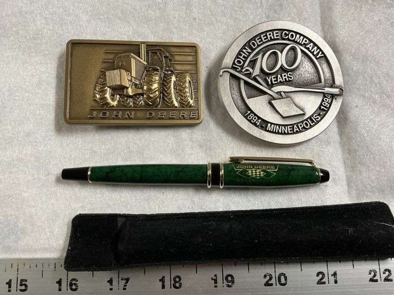 John Deere belt buckles & pen - Legacy Auction Company