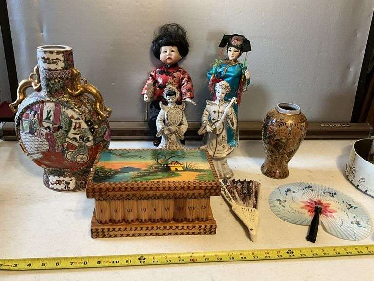 Oriental dolls, fans, and decorative pieces - Legacy Auction Company