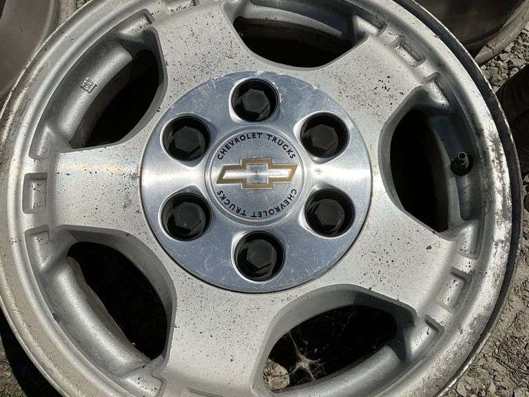 2001 Chevy pickup rims 16" w/ lug nuts. - Legacy Auction Company