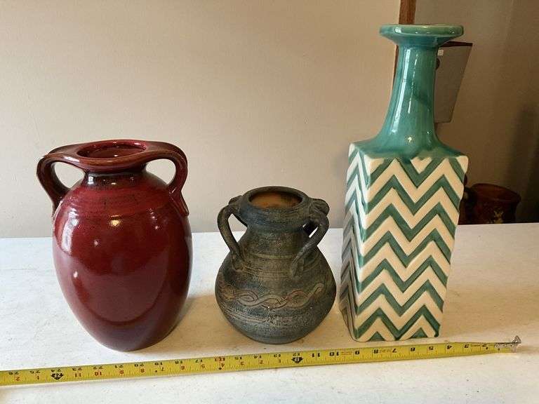 Three vases up to 17 inches tall. - Legacy Auction Company