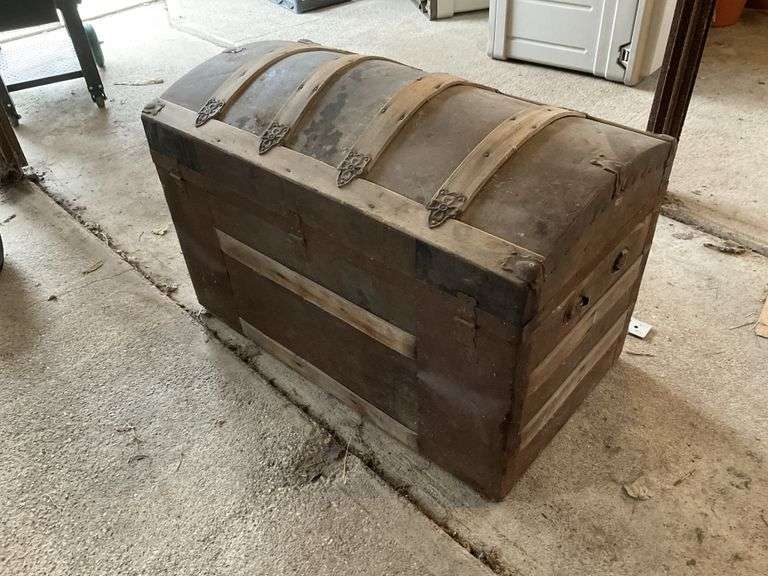 Antique camelback trunk - Legacy Auction Company