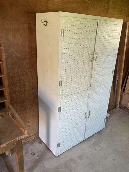 Storage cabinet. Approximately 44 inches wide by - Legacy Auction Company