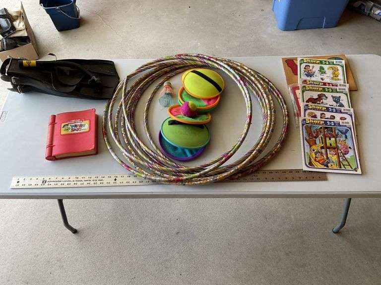Assorted puzzles, hula, hoops, scuba fins etc. - Legacy Auction Company