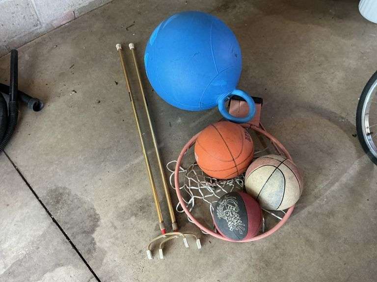 Shuffleboard sticks, basketball hoop, bouncy ball - Legacy Auction Company