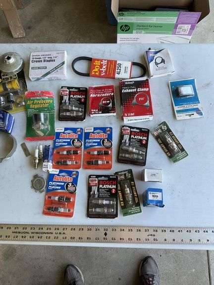 Assorted spark plugs, die grinder, filter, - Legacy Auction Company