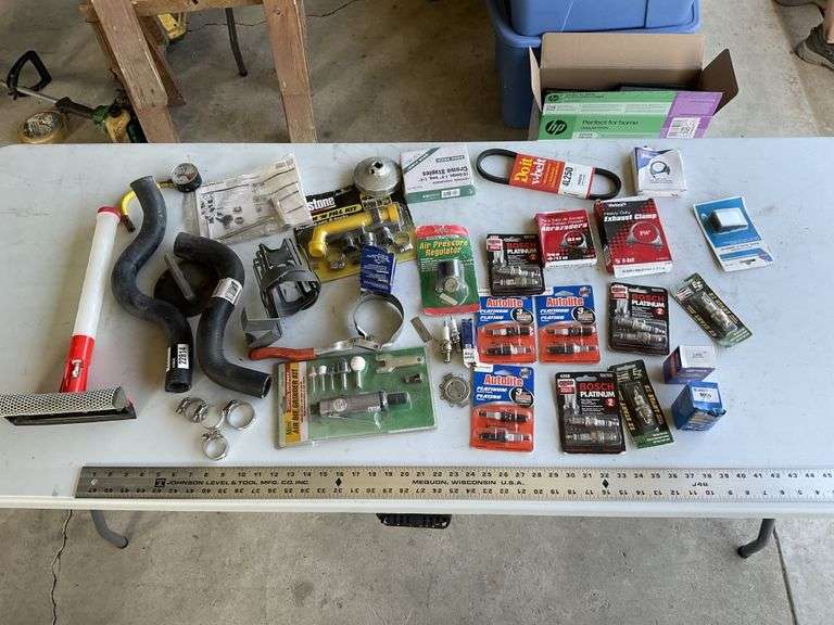 Assorted spark plugs, die grinder, filter, - Legacy Auction Company