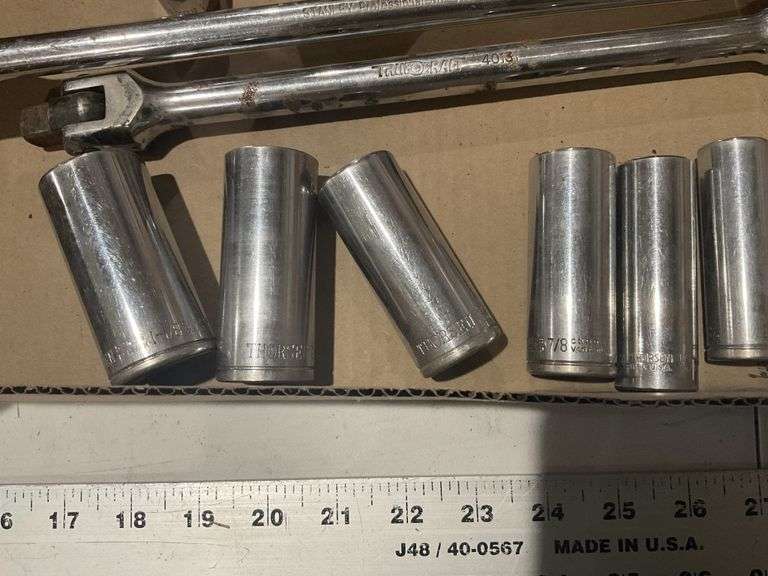 1/2" assorted Deep well sockets, breaker bars - Legacy Auction Company