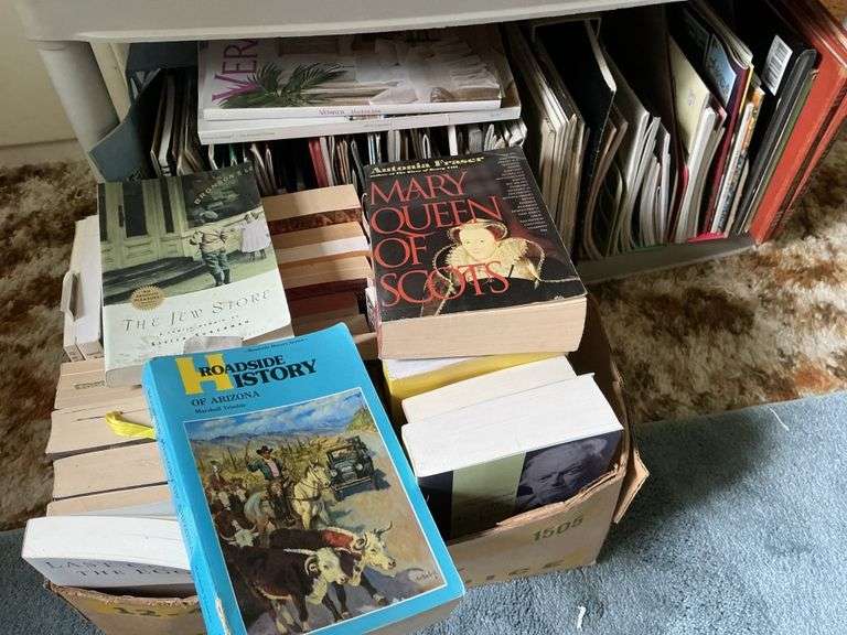 Plastic shelf with books-bring boxes - Legacy Auction Company