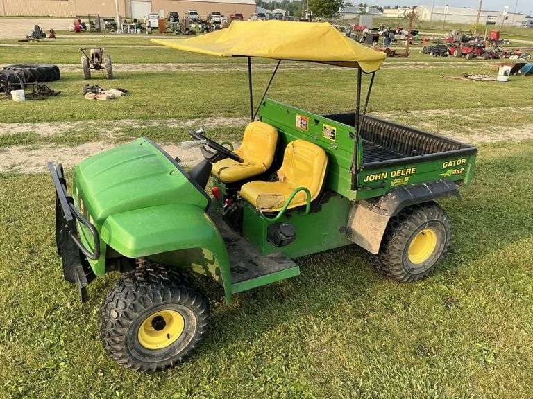 John Deere 4x2 Gator w topper, 1524 hours - Legacy Auction Company