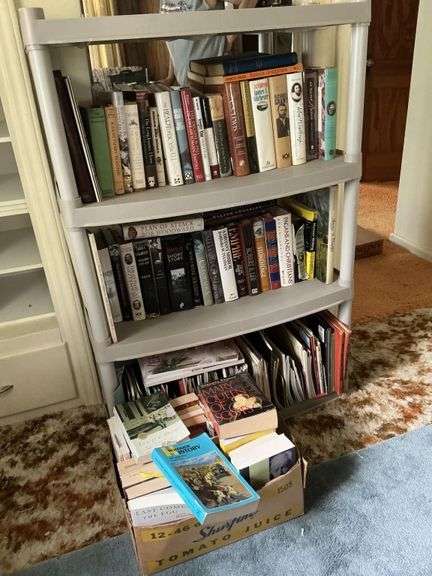 Plastic shelf with books-bring boxes - Legacy Auction Company