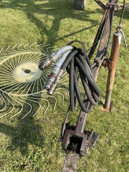 Gehl 10 wheel hay rake on homemade carrier - Legacy Auction Company