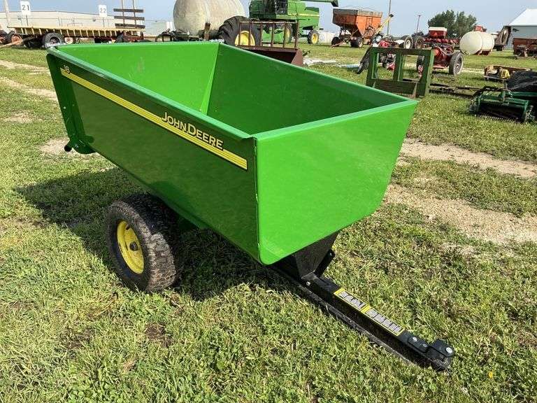 John Deere 18 dump trailer - Legacy Auction Company