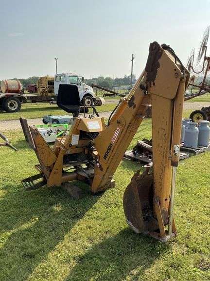 Woods 1050 three-point backhoe - Legacy Auction Company