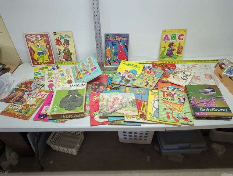 Old coloring books, paper dolls etc - Legacy Auction Company