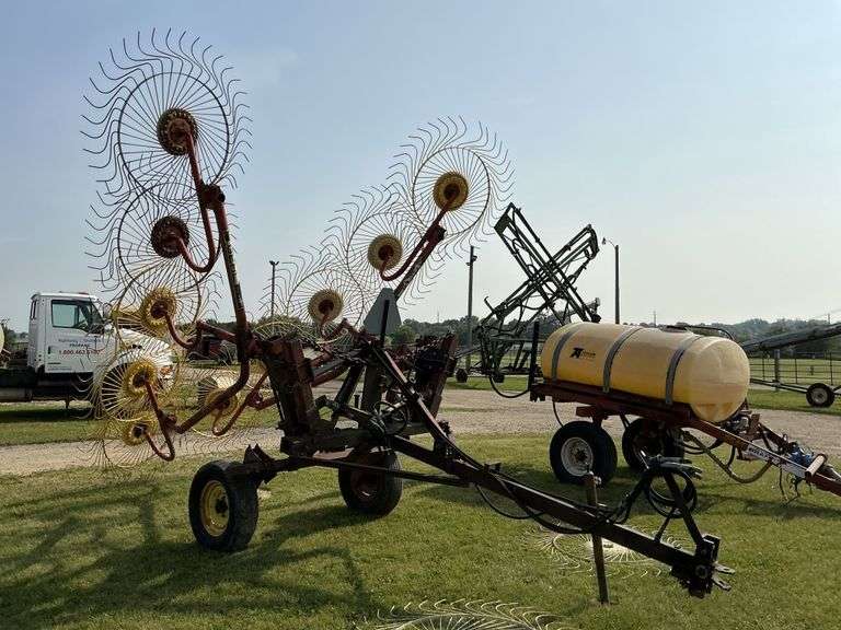 Gehl 10 wheel hay rake on homemade carrier - Legacy Auction Company