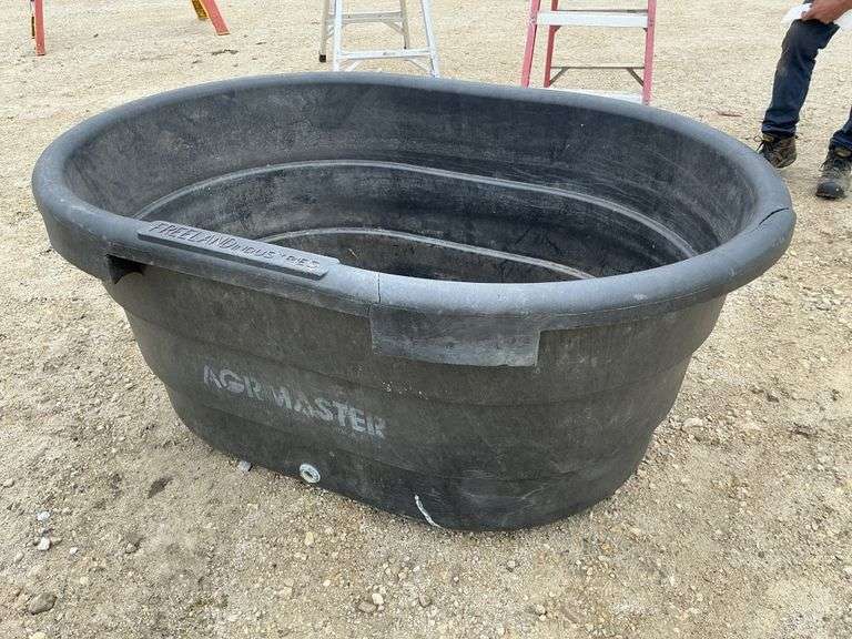 Freeland industries poly tank, cracked on top 57" - Legacy Auction Company