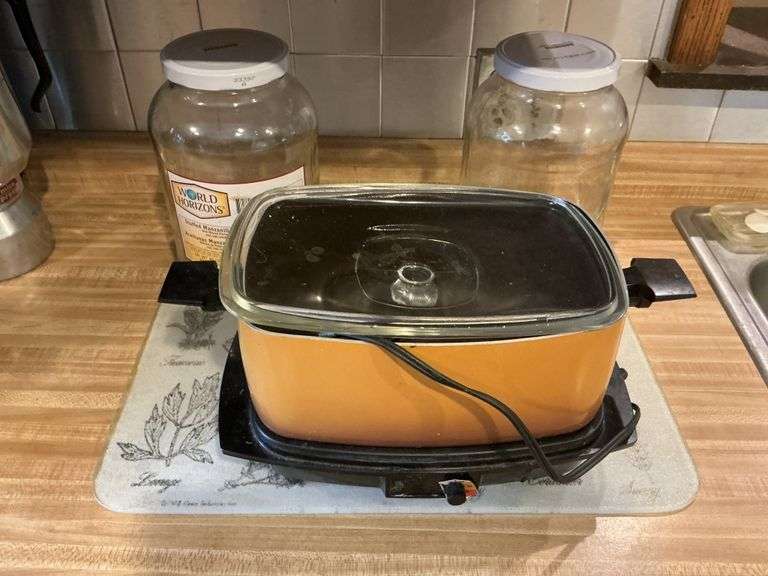 Jars, slow cooker, cutting board - Legacy Auction Company