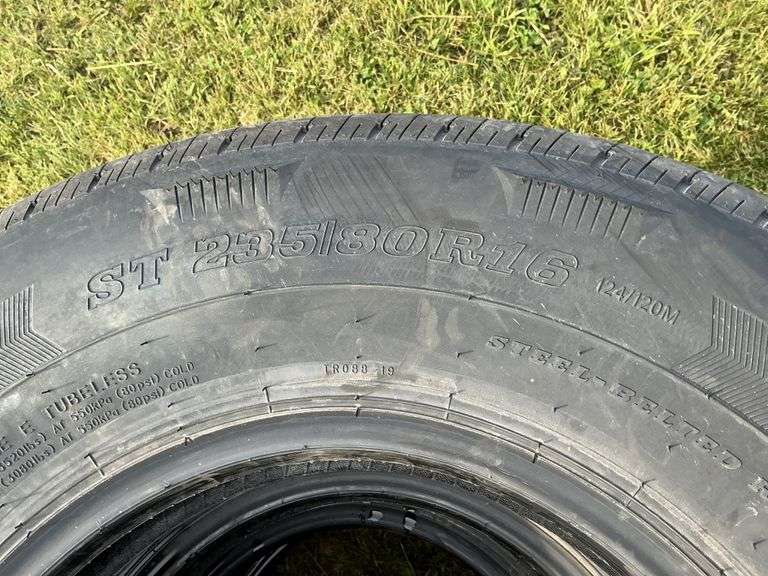 Four near new Rainier ST235/80R16 tires - Legacy Auction Company