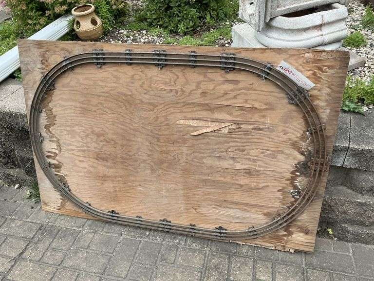 O gauge train track on board 51" x 33" - Legacy Auction Company