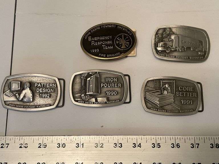 5- John Deere belt buckles - Legacy Auction Company