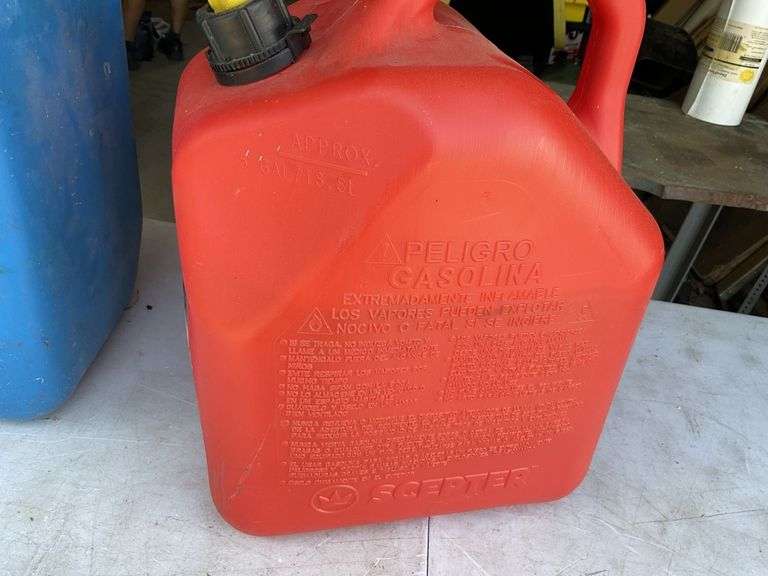 Gas and kerosene fuel cans, gas half full - Legacy Auction Company